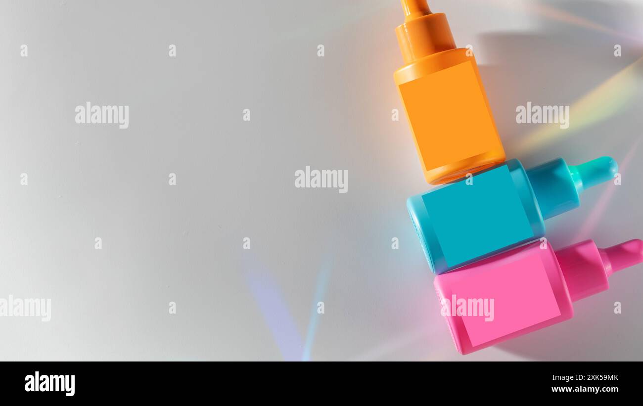 Bright color pipette bottles on light background upper view. Beauty ...