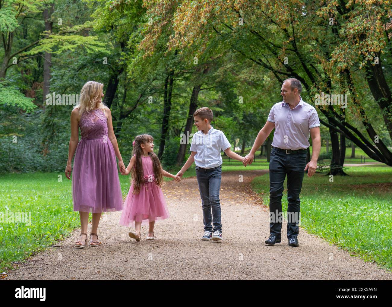 Portrait of a happy family. Laughing dad and mom, teenage son and first ...
