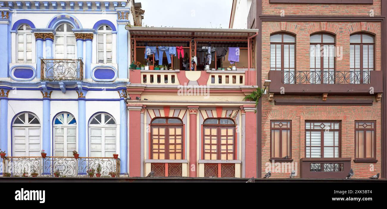 Street view with facades of old colonial buildings in Quito, Ecuador ...
