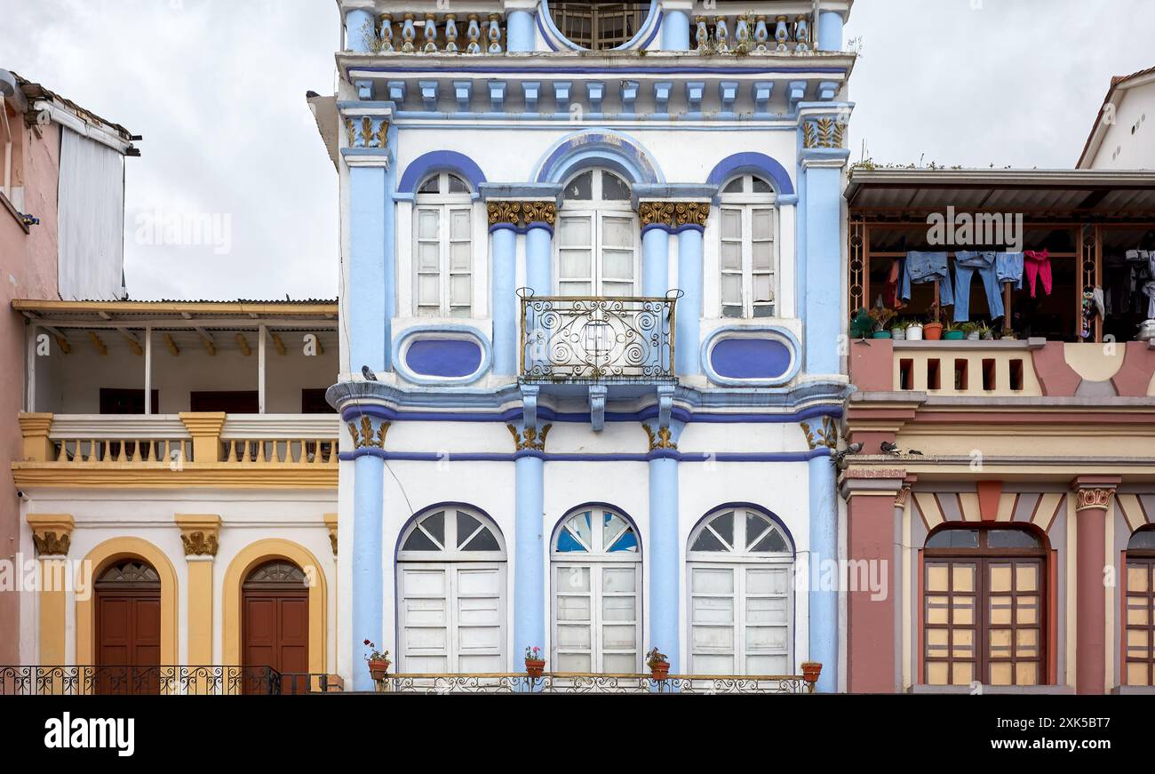 Street view with facades of old colonial buildings in Quito, Ecuador ...