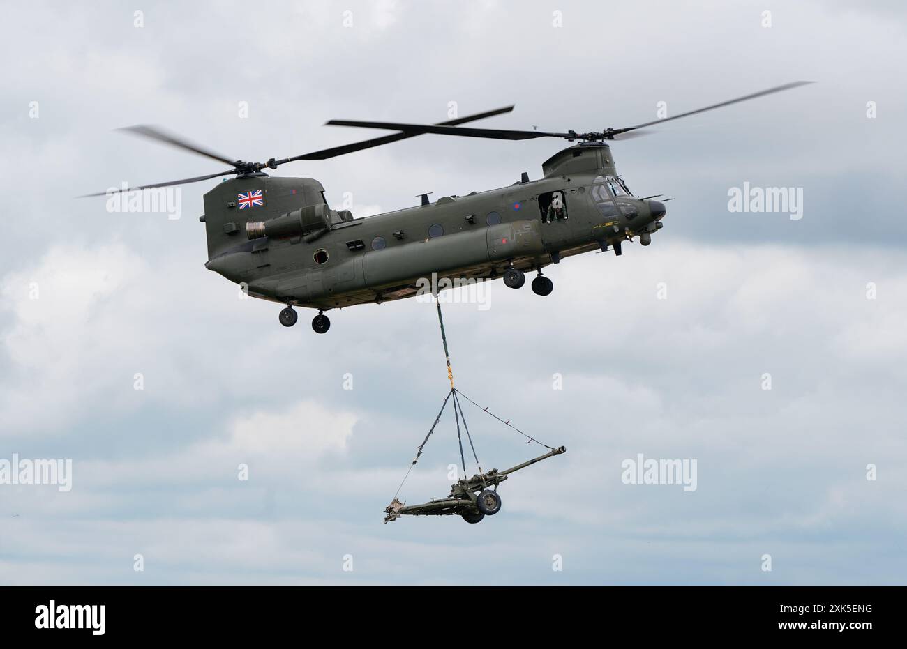 A Chinook from the RAF Chinook Display Team carries a field gun during ...