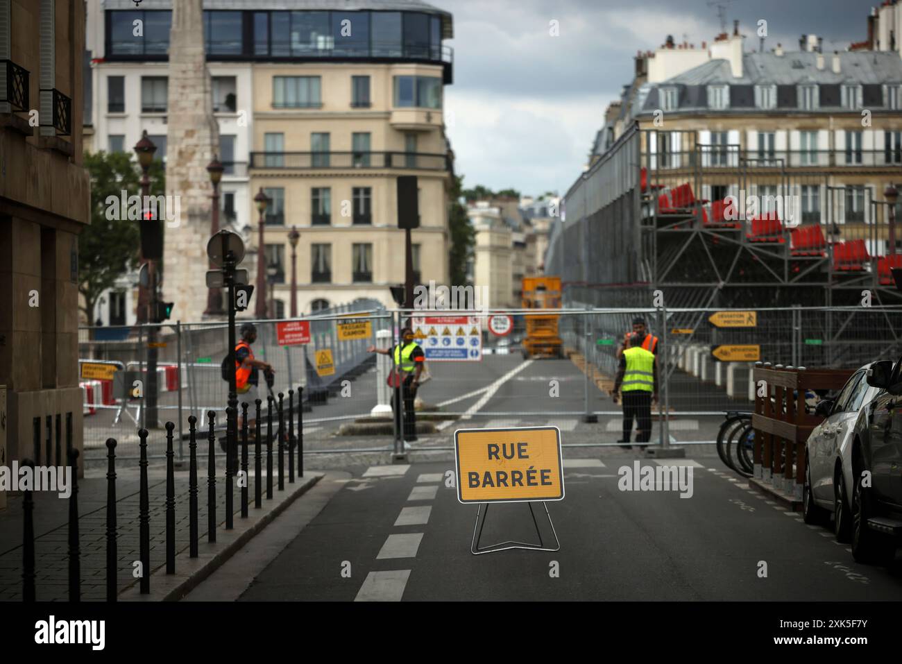 Security officers stand at the security perimeter by a barred street at ...