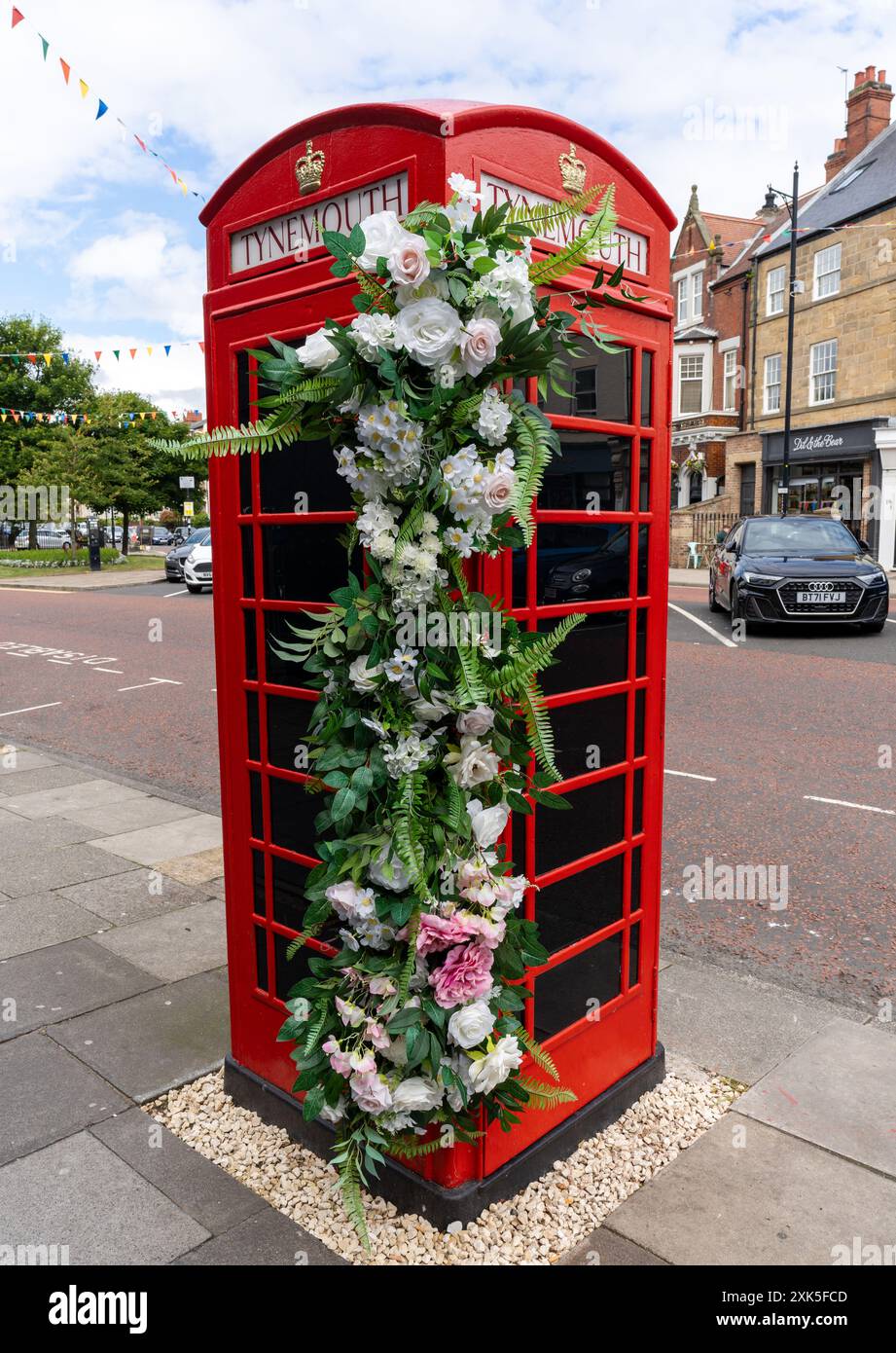 Tynemouth, North Tyneside, UK. Repurposed red telephone box on Front ...
