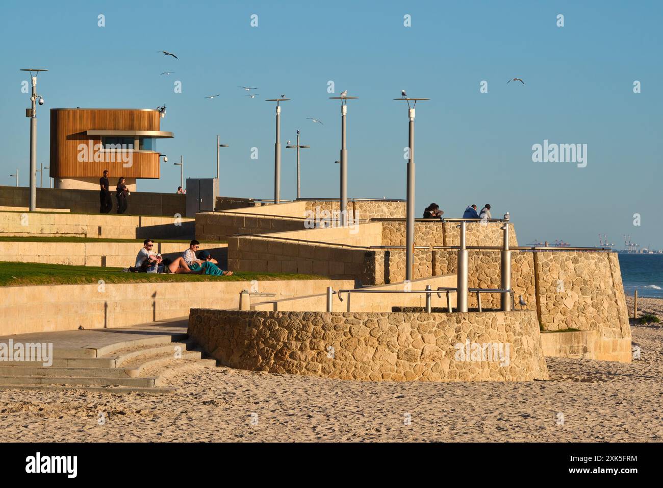 People enjoying the sunset at Scarborough Beach Amphitheatre and ...