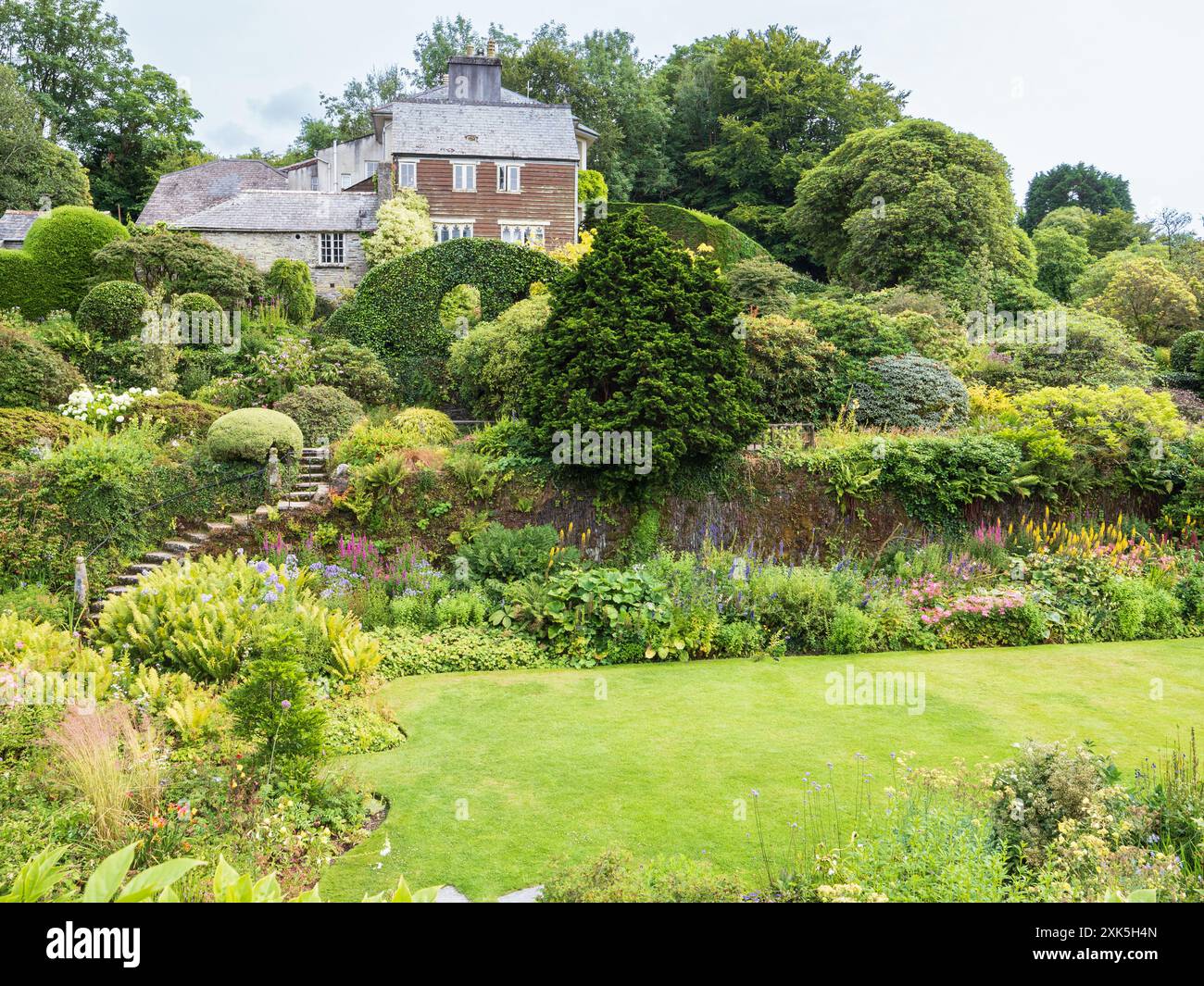 Summer view of the Tennis court and upper terraces of the walled garden ...