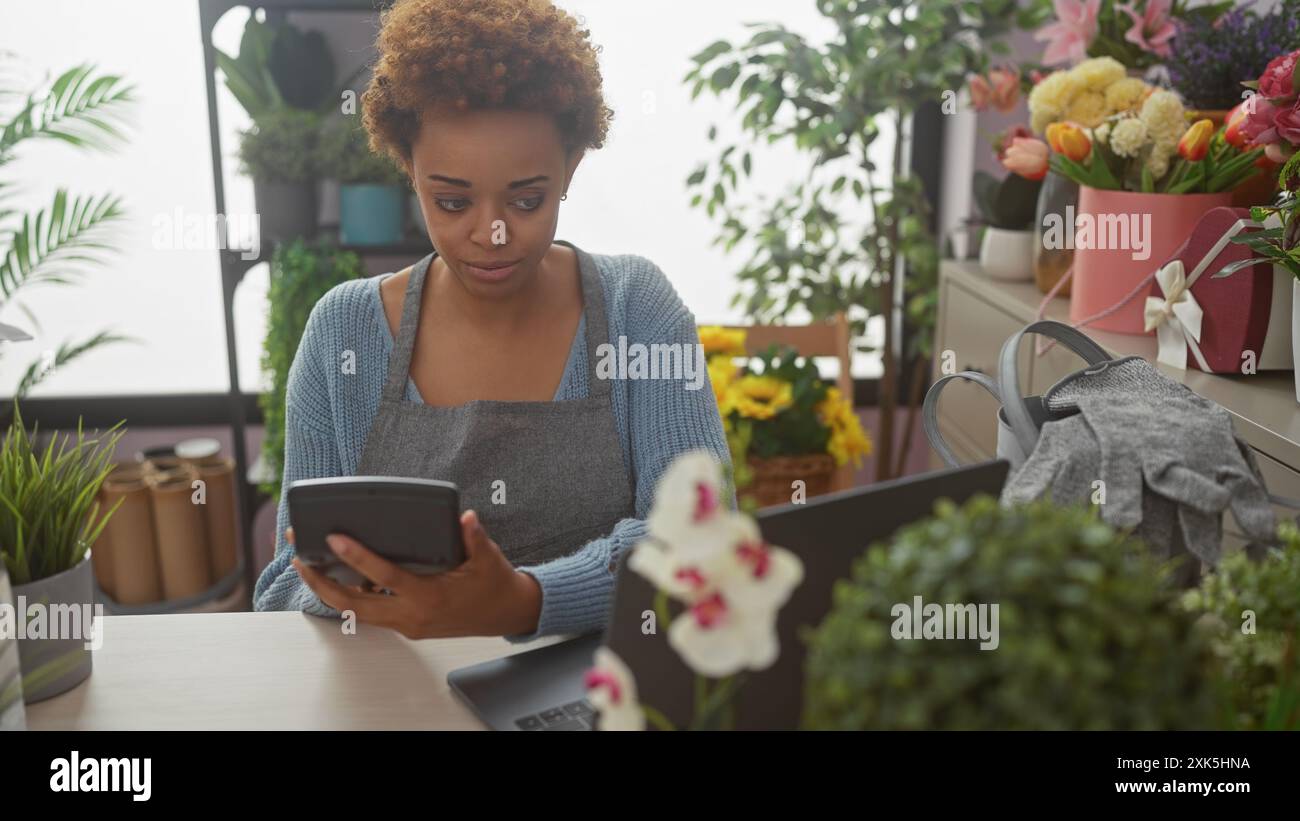 African woman with a calculator hi-res stock photography and images - Alamy