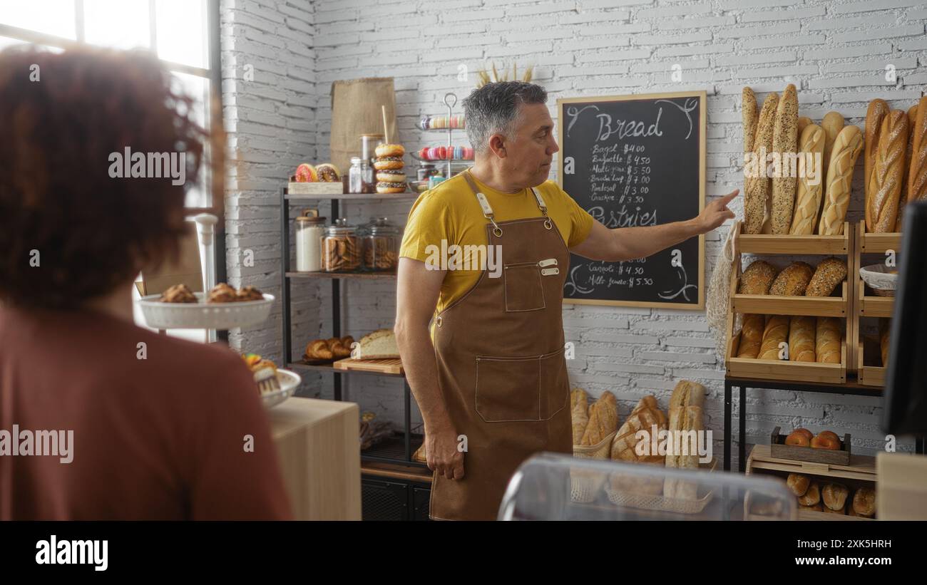 Customer talking baker counter hi-res stock photography and images - Alamy