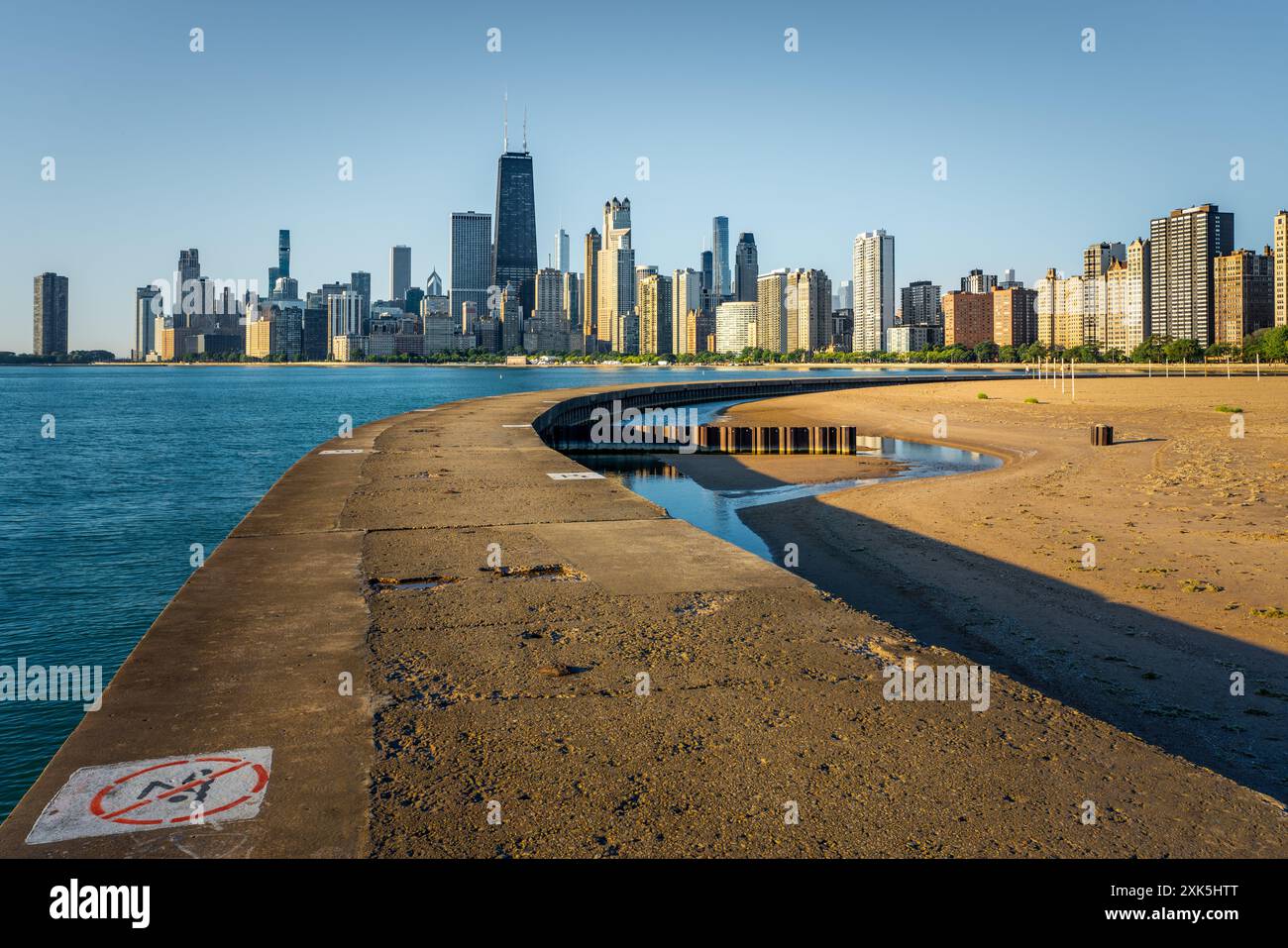 Chicago, Illinois waterfront and skyline at dawn with walking path and ...