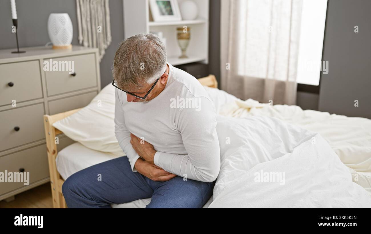 Man resting hands on stomach hi-res stock photography and images - Alamy