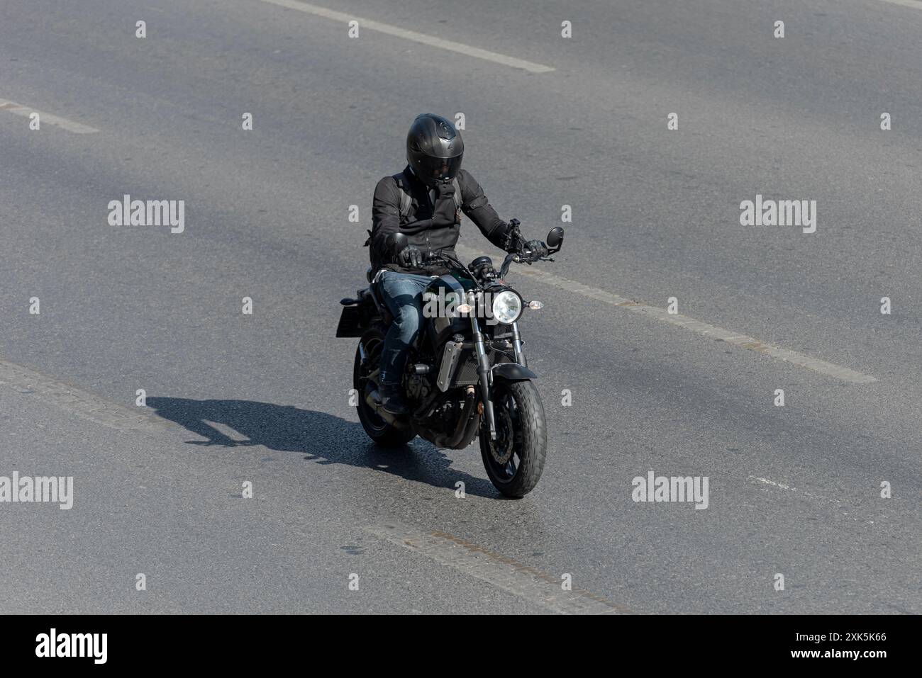 ISTANBUL, TURKEY - JULY 7, 2024: Man from city riding motorcycle on the ...