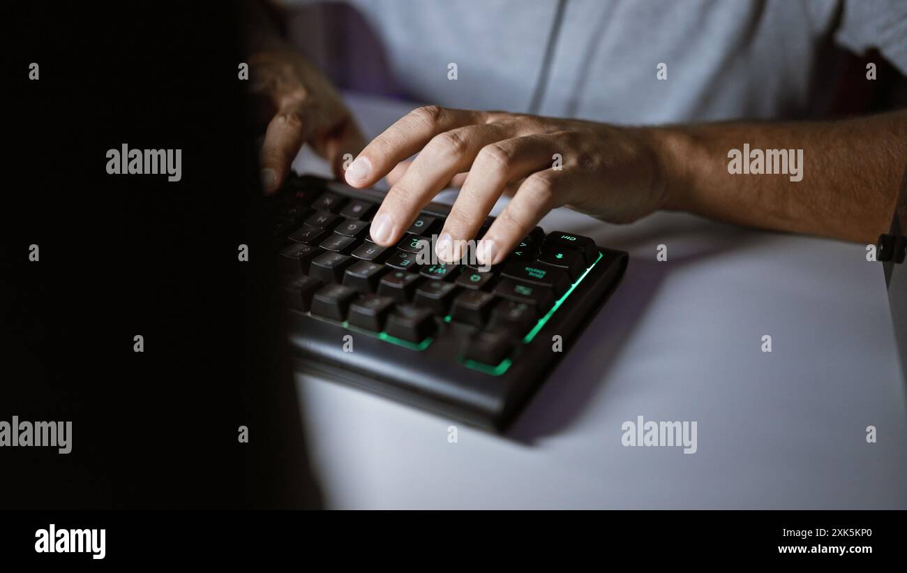 Hands typing on backlit keyboard hi-res stock photography and images ...
