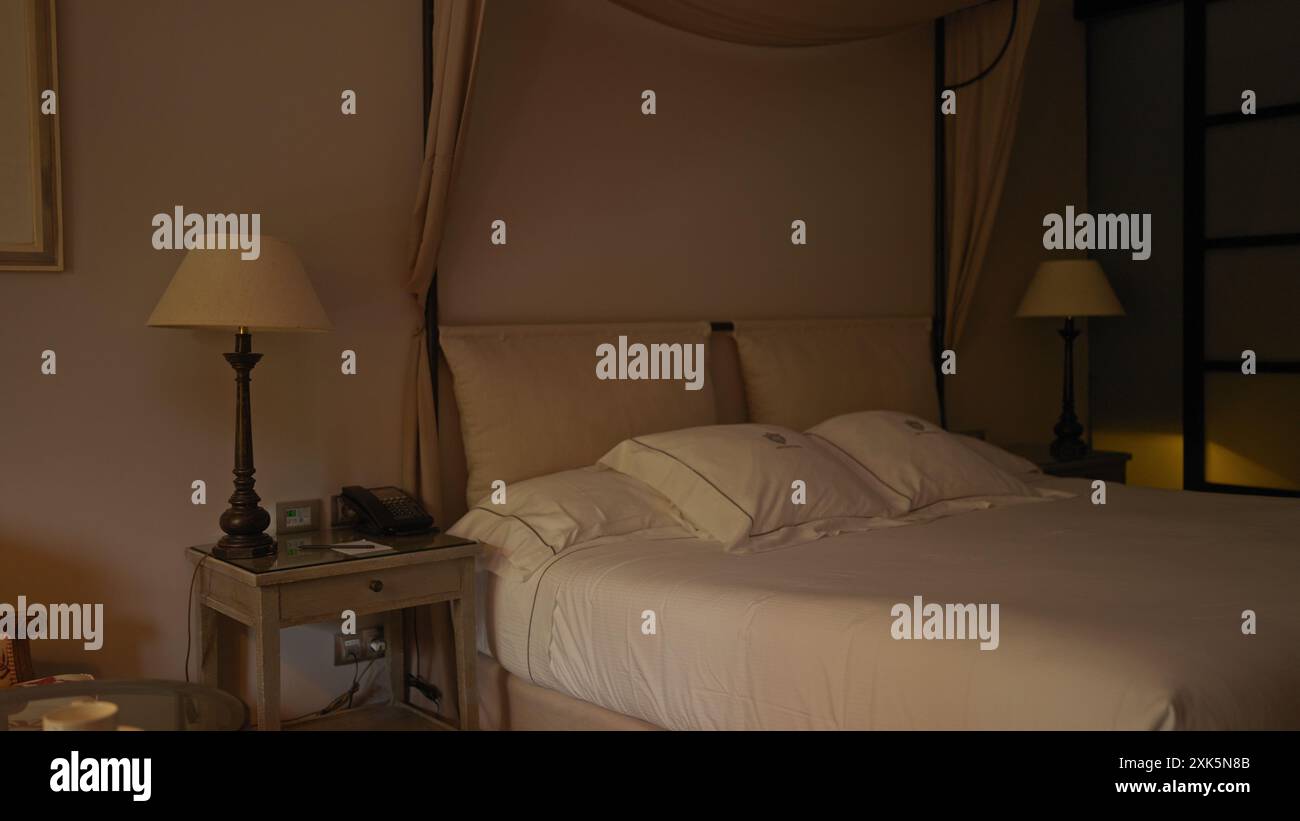 Elegant bedroom interior with a cozy king-size bed, bedside tables and ...