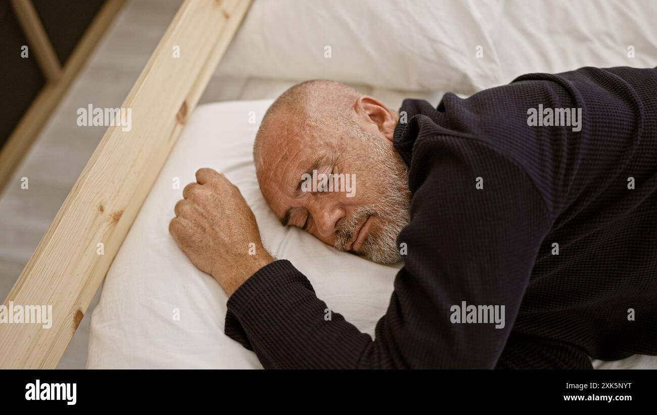 Elderly man is sleeping soundly in his bed hi-res stock photography and ...