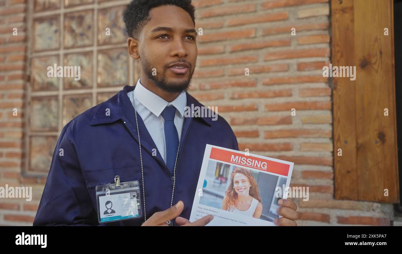 African-american man in uniform showing a missing person flyer outdoors ...