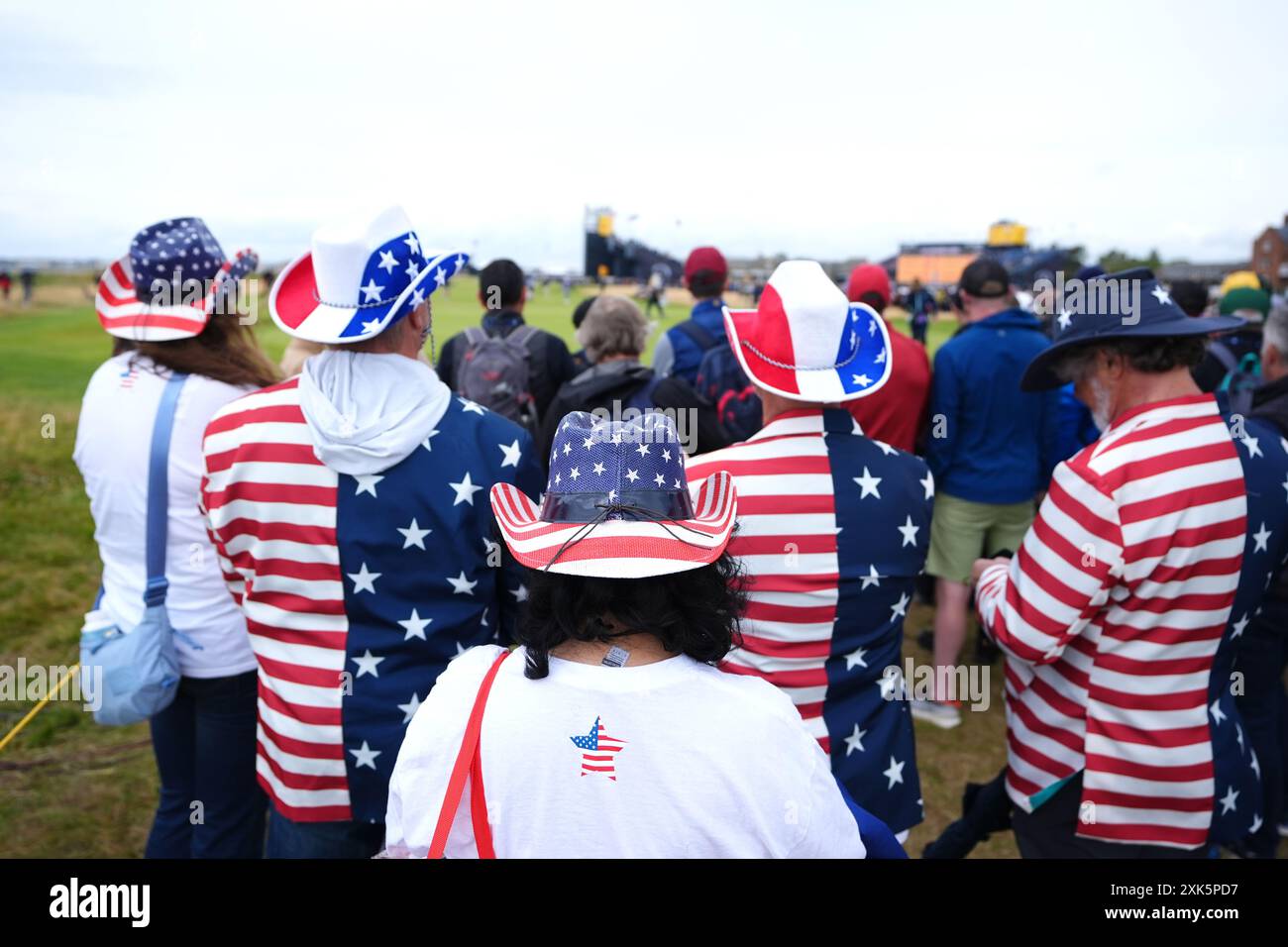 Spectators wearing fancy dress with the design of the American flag ...