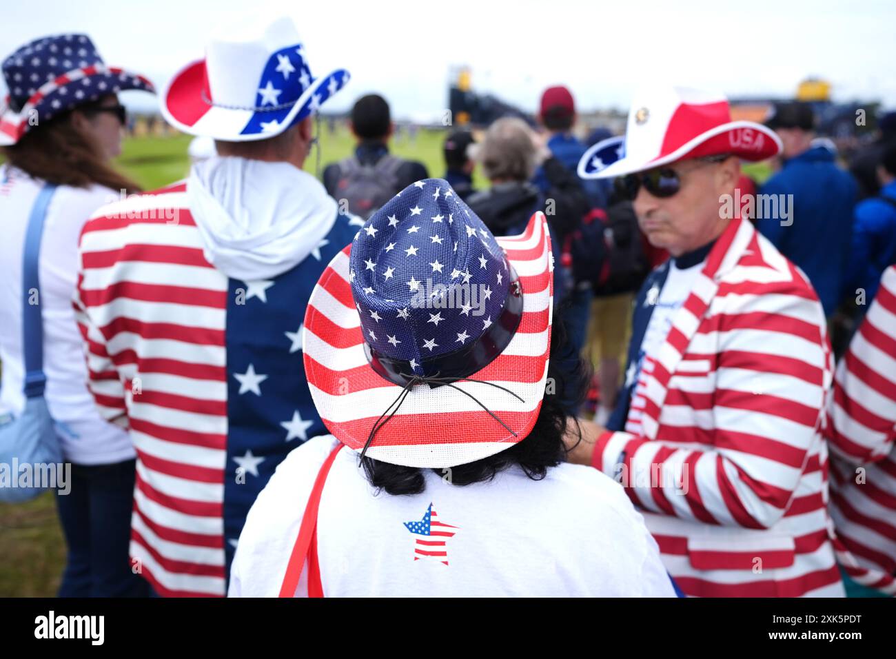 Spectators wearing fancy dress with the design of the American flag ...