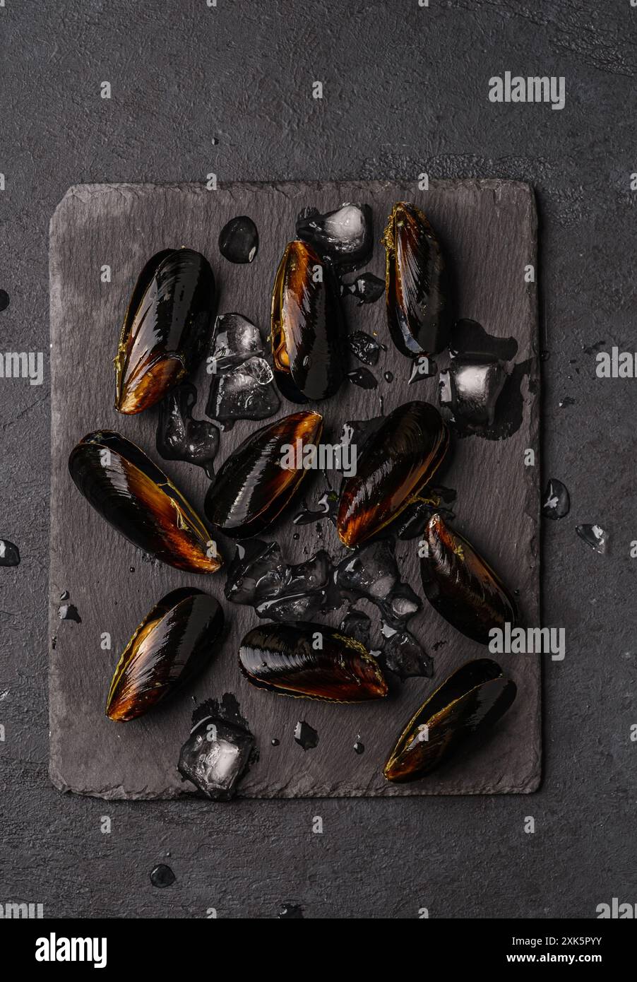 mussels raw on a blackboard Stock Photo - Alamy