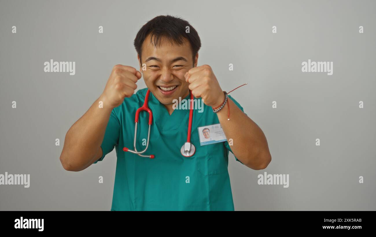 An attractive young chinese man wearing scrubs and a stethoscope ...