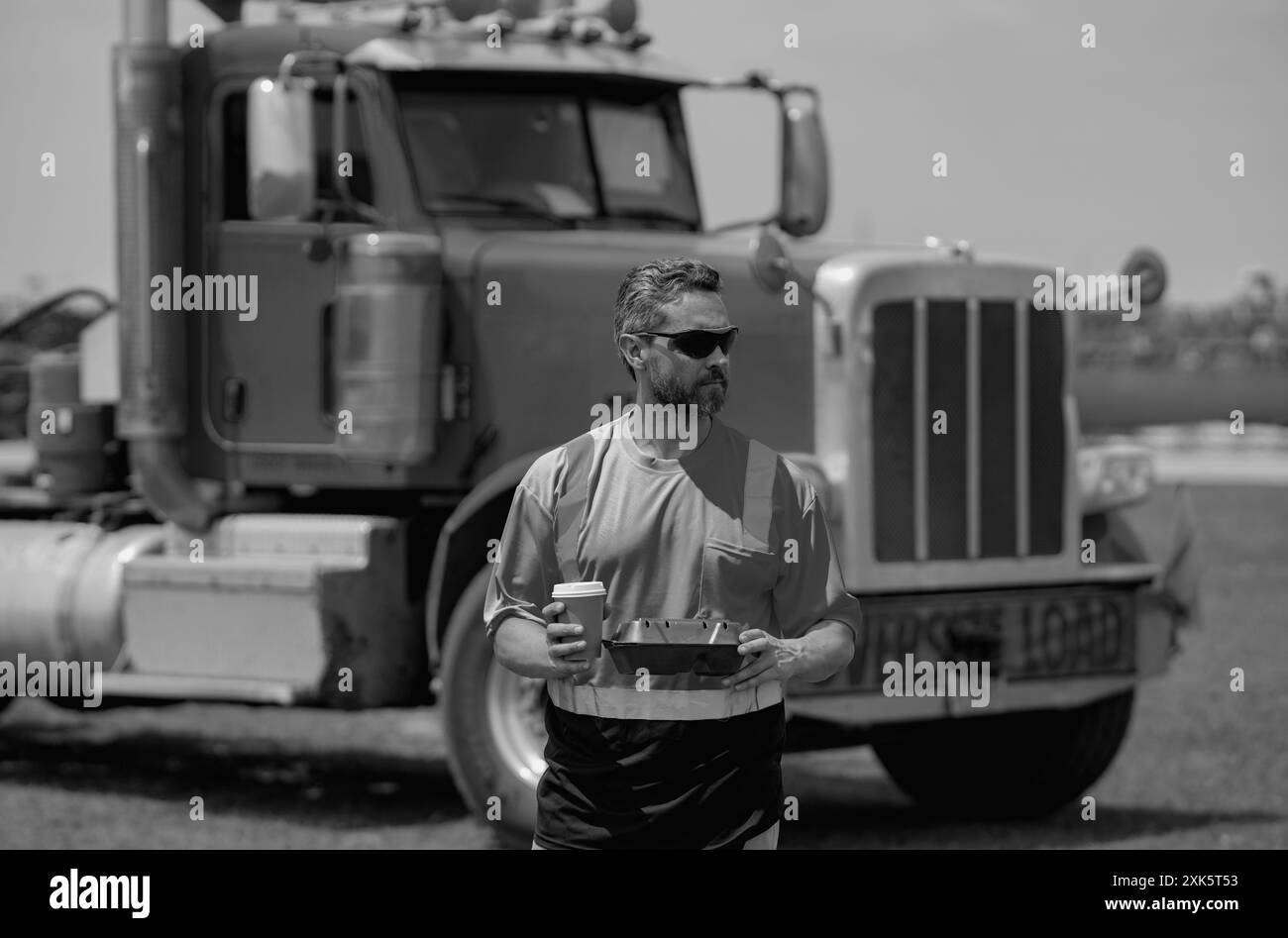 Men driver near lorry truck. Man owner truck driver in safety vest ...