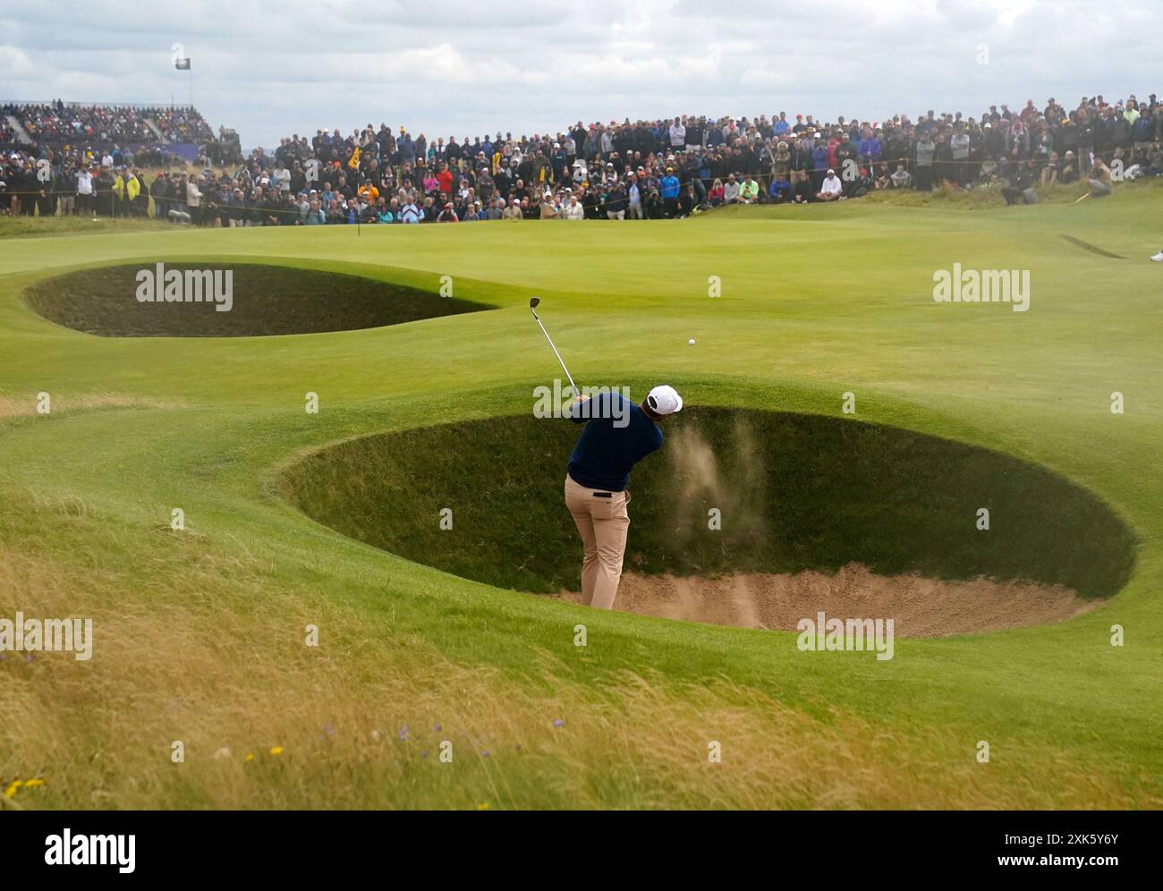 USA's Scottie Scheffler chips out of a bunker on the 4th during day ...