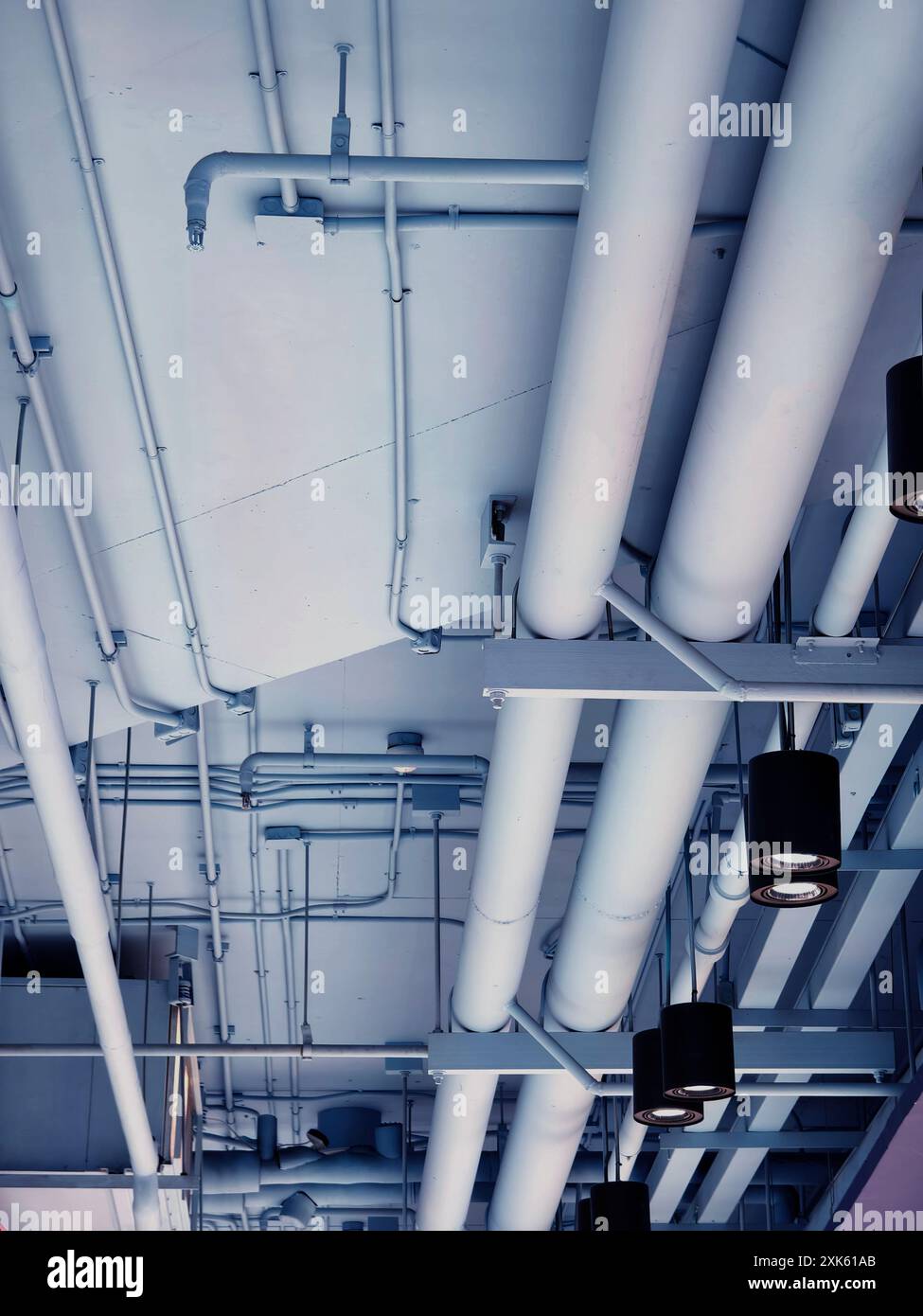 Ceiling with ventilation pipes and lights in industrial building Stock ...