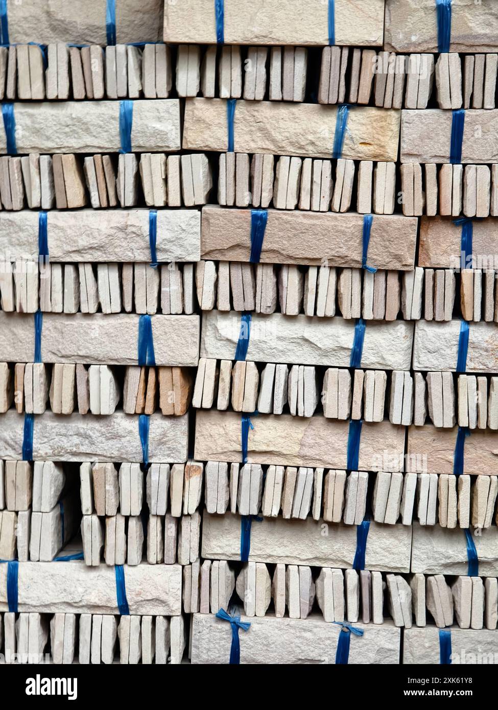 Brick stack tied with ropes for construction and building purposes ...