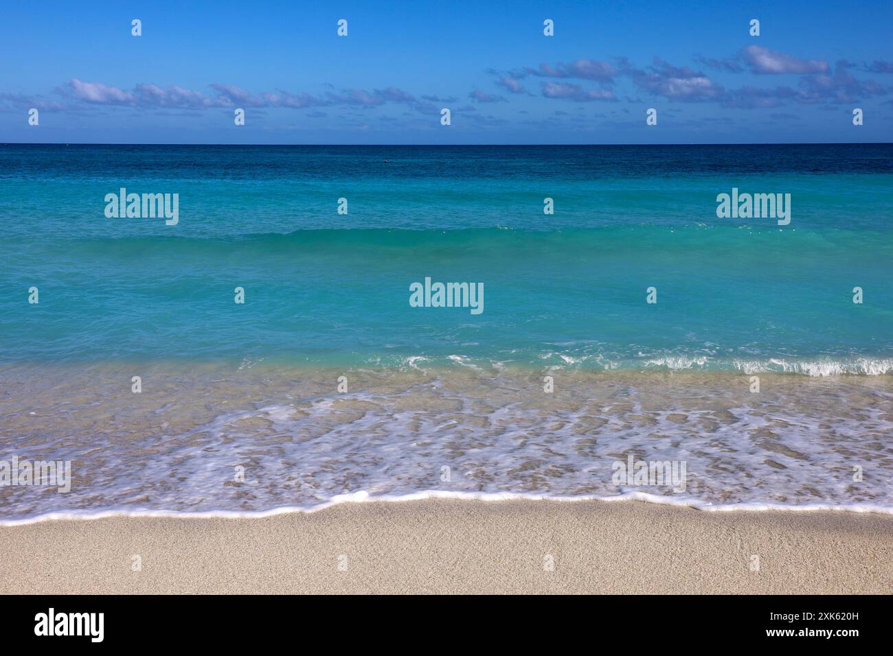 Empty sea beach with white sand, view to azure waves and blue sky with ...