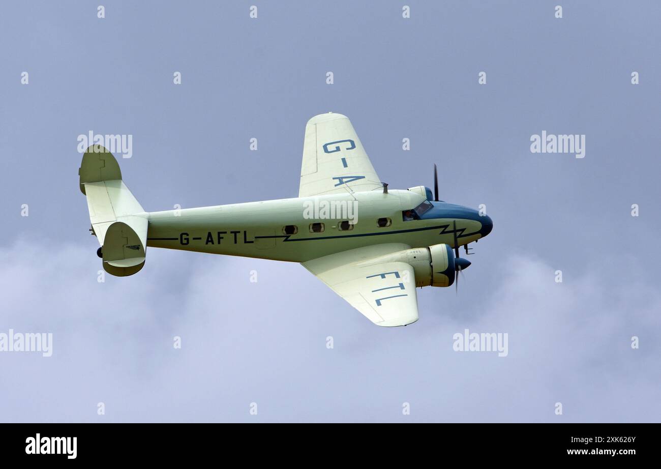 Vintage Lockheed 12A Electra Junior in flight Stock Photo - Alamy