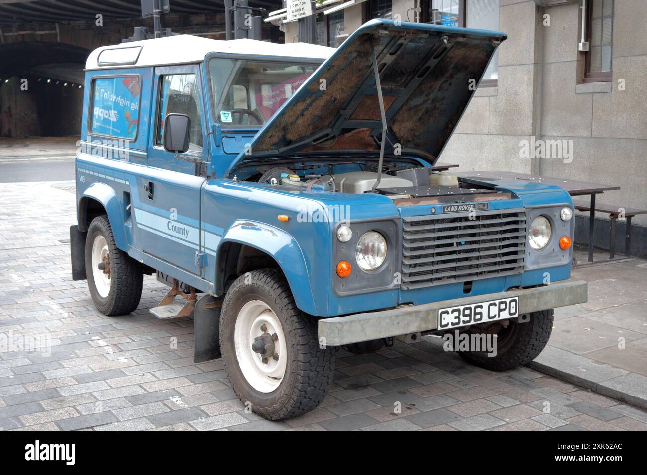 Land Rover 90 Defender off-road blue car with hood open Stock Photo - Alamy