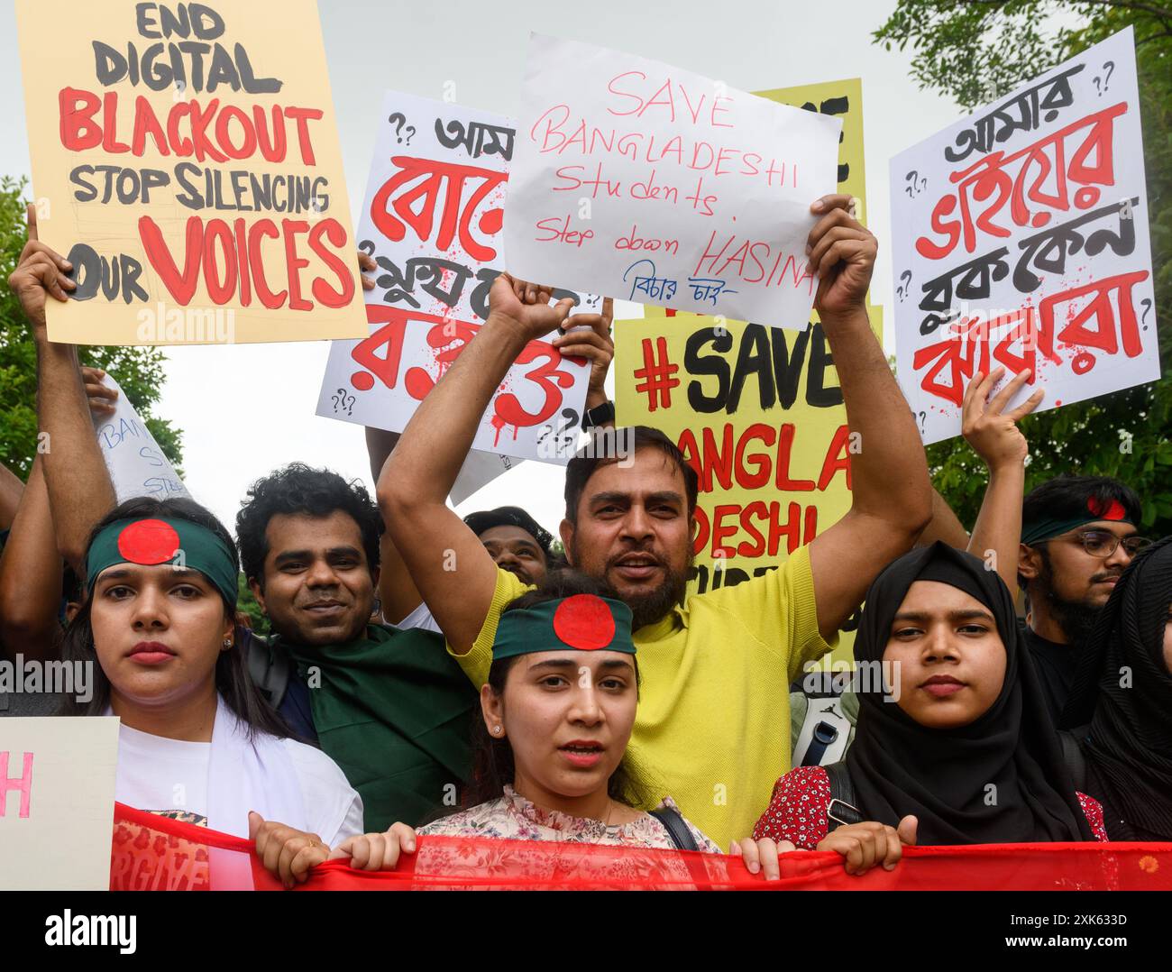 Bangladeshis residents in South Korea hold placards during a rally in ...