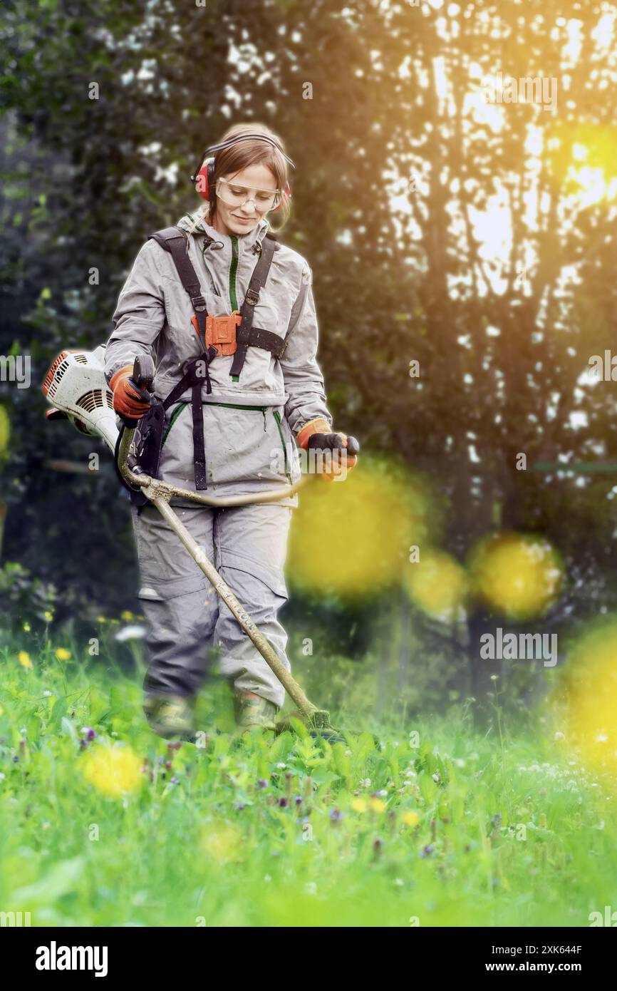 A woman happily trims her garden in a sunny meadow, showing devotion to ...