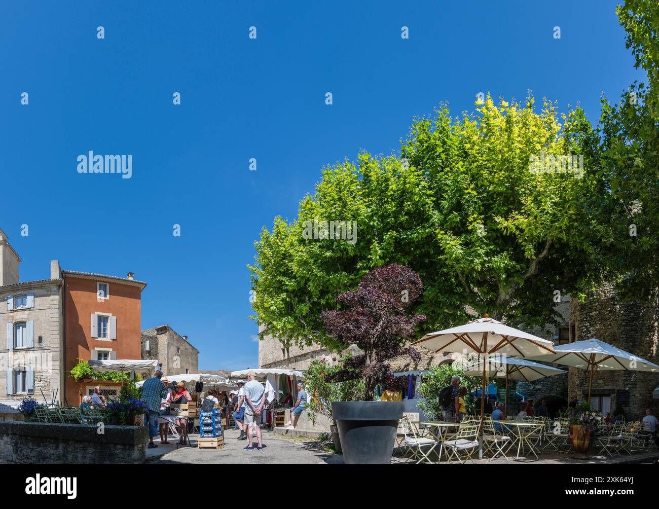 Market day at the village of Gordes, Vaucluse in Provence, France Stock ...