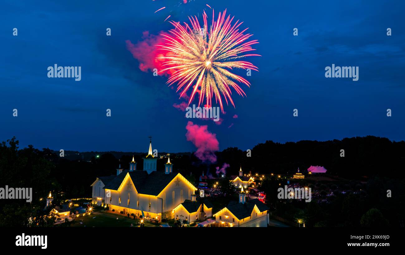 Bright Red And Gold Fireworks Light Up The Night Sky Over A Picturesque ...