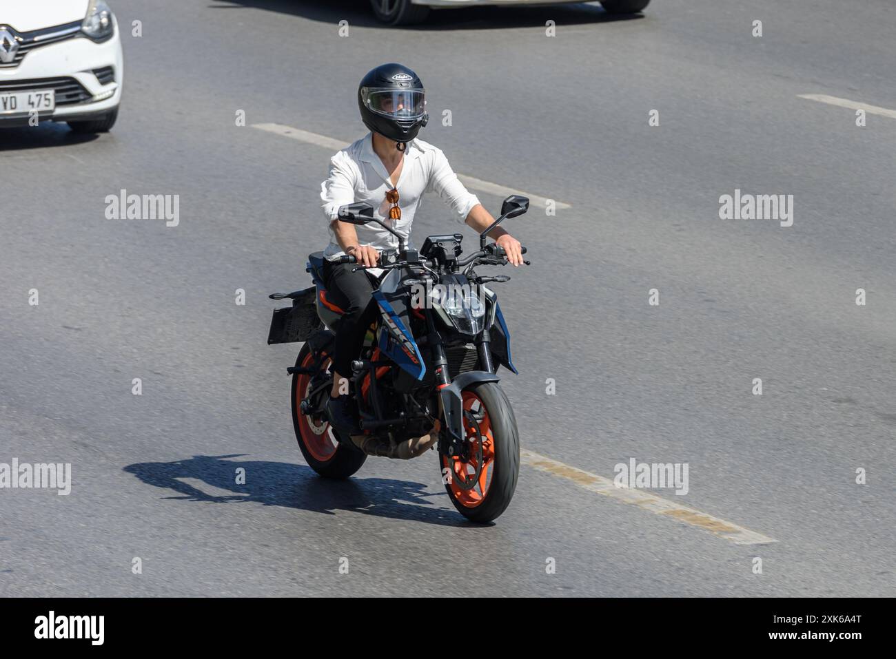 ISTANBUL, TURKEY - JULY 7, 2024: Man from city riding motorcycle on the ...