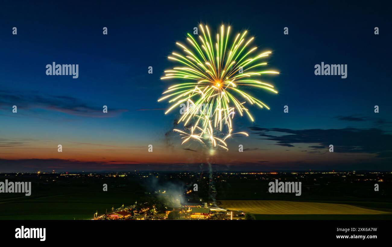 Green And Yellow Firework Burst Illuminating The Night Sky Above A Farm ...