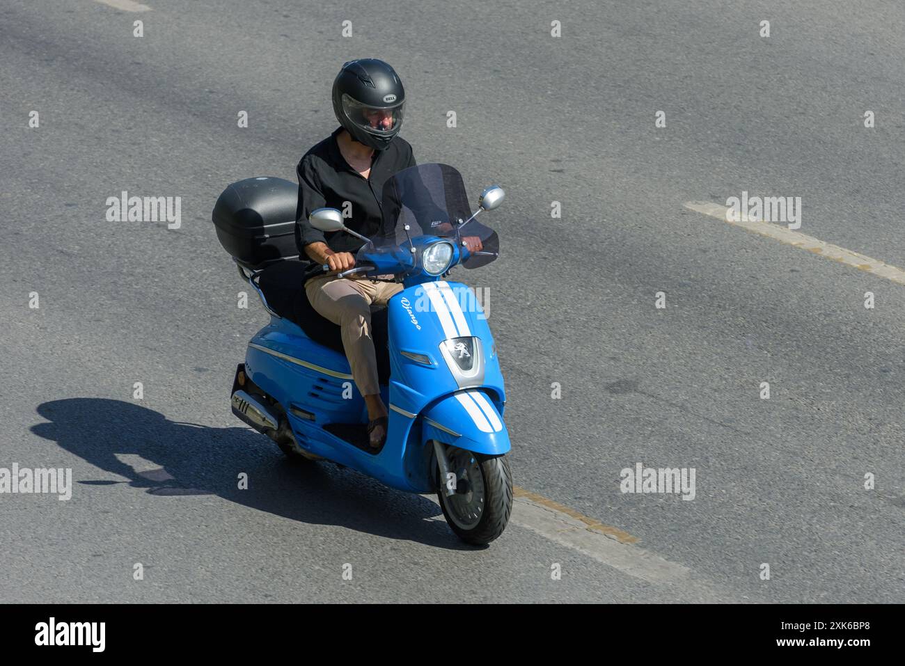 ISTANBUL, TURKEY - JULY 7, 2024: Man from city riding motorcycle on the ...