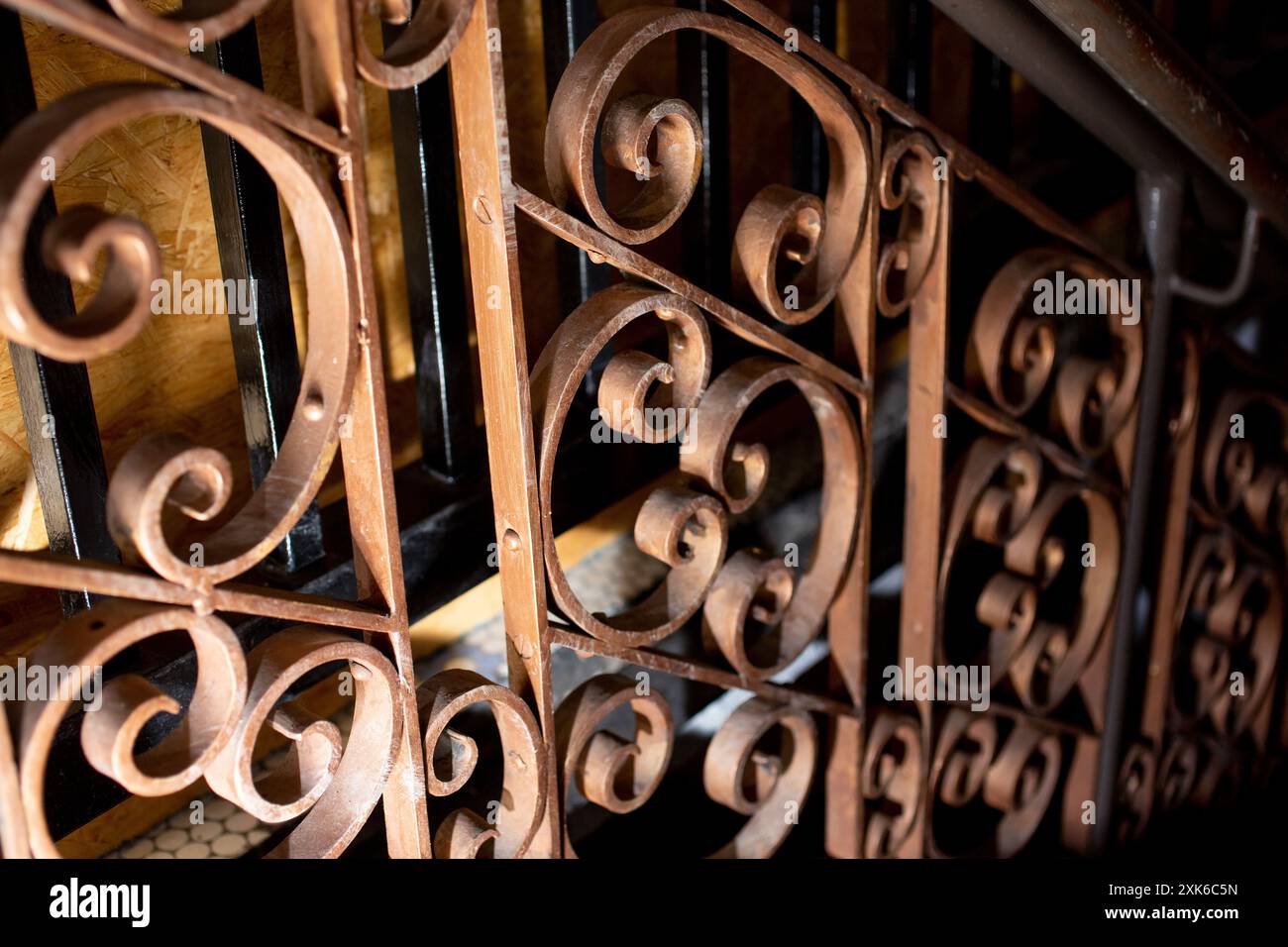 A view of an antique iron staircase railing design with dramatic ...