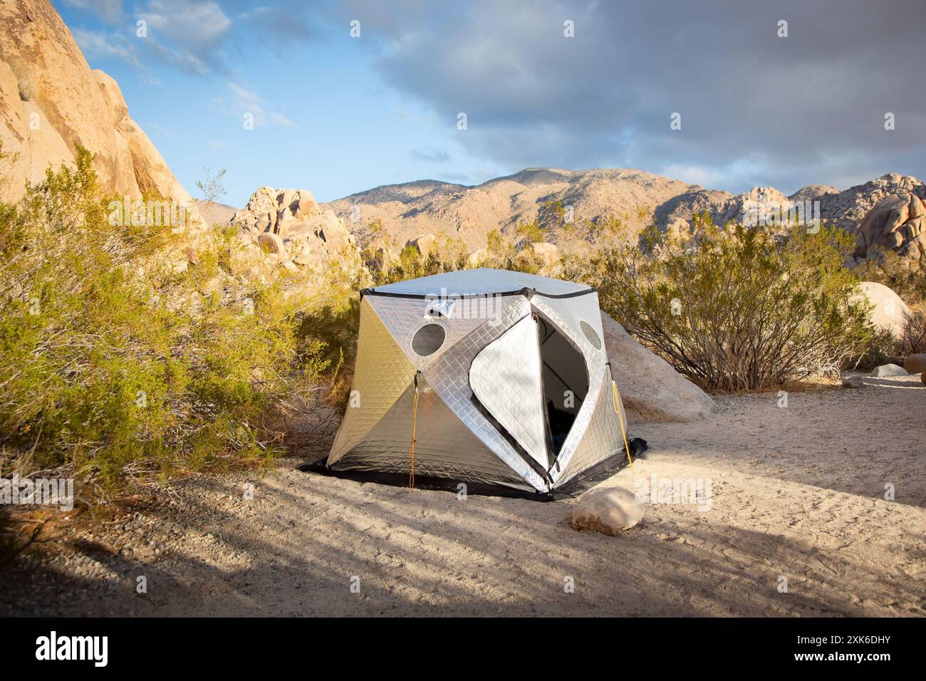 A view of a rocky desert landscape, featuring a heat controlled tent ...