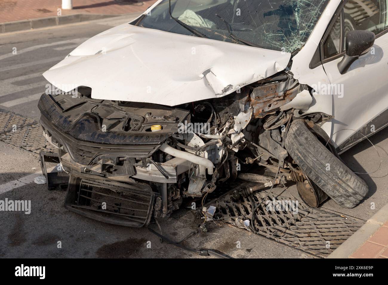 Car with severe frontal damage after an accident, featuring crumpled ...