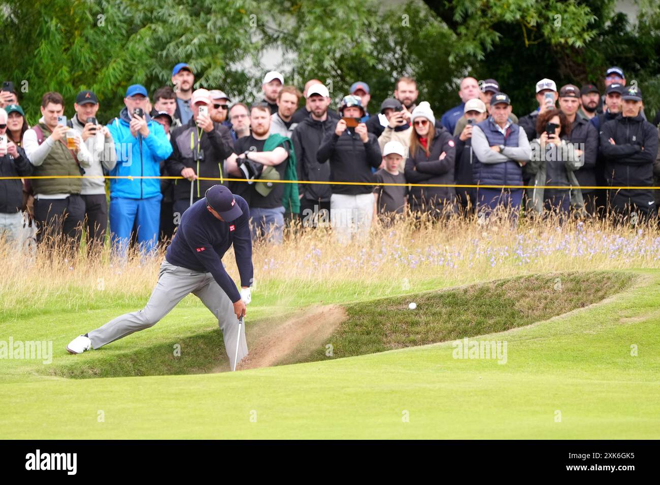 Australia's Adam Scott chips out of a bunker on the 16th during day ...