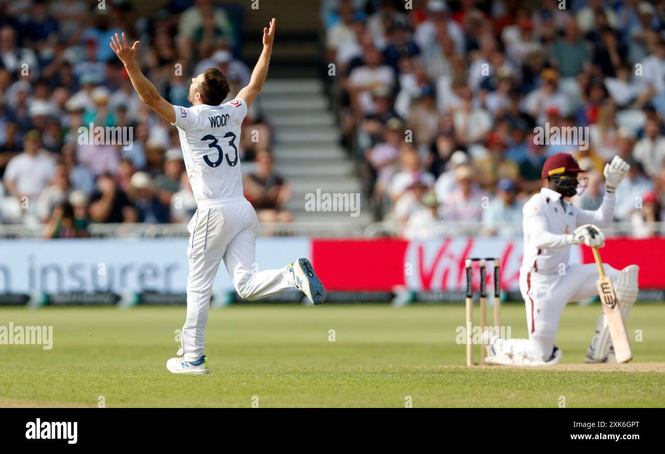 England's Mark Wood (left) celebrates taking the wicket of West Indies ...