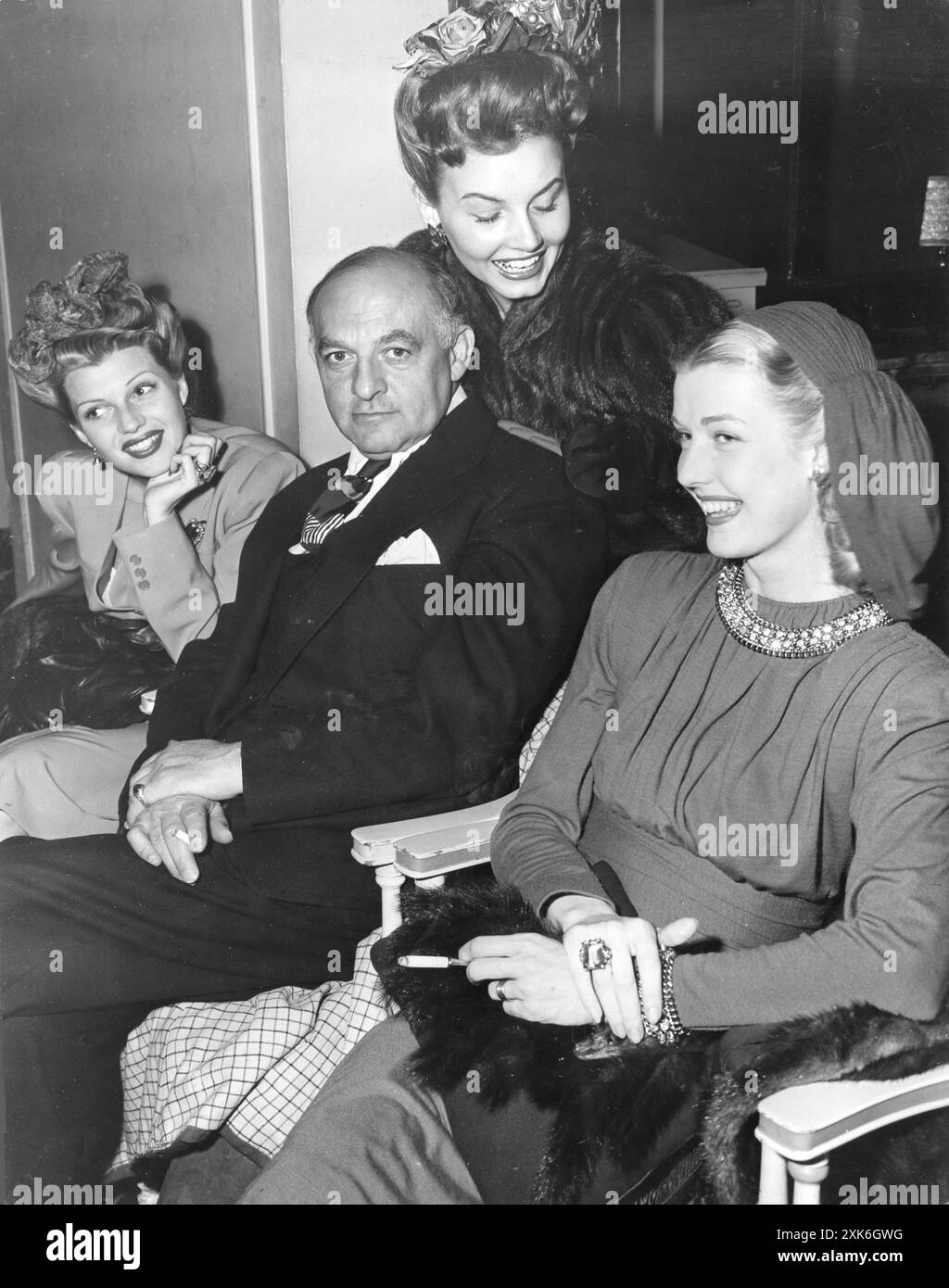 RITA HAYWORTH, Producer HARRY COHN, JANET BLAIR and ANITA LOUISE ...