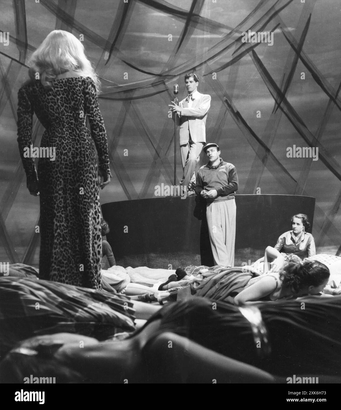 BELITA, GENE KELLY and IRVING DAVIES (at the microphone) rehearsing a ...