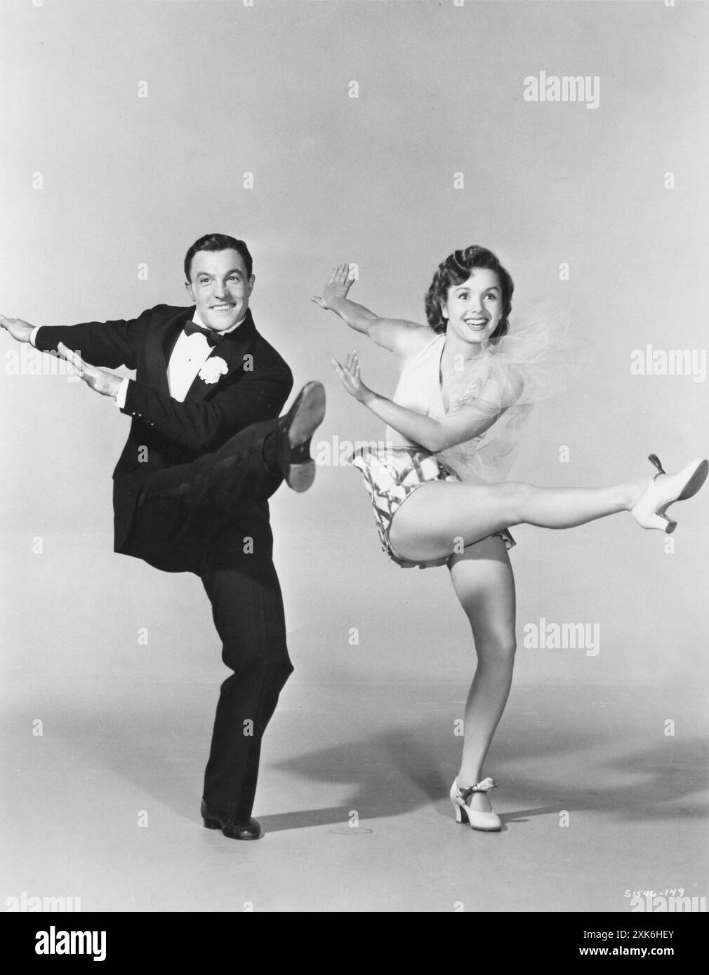 GENE KELLY and DEBBIE REYNOLDS in a publicity portrait from SINGIN' IN ...
