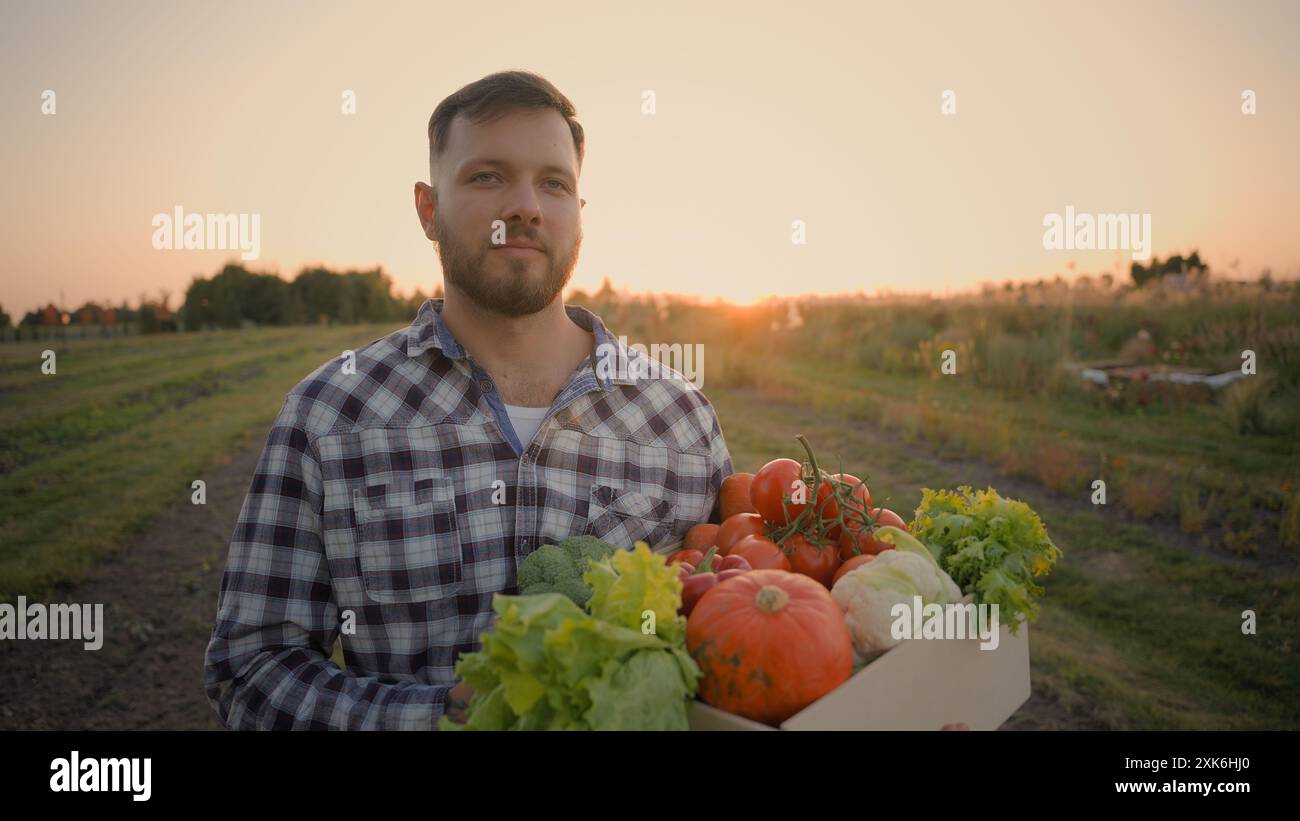 Caucasian male man guy farmer carrying rich harvest hands holding ...