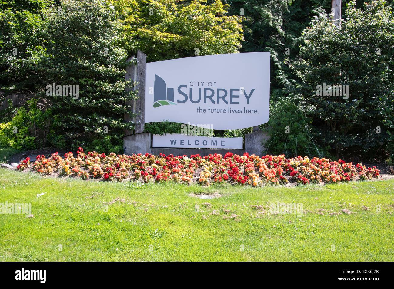 Welcome to the city Surrey sign with flowers in full bloom on Highway ...