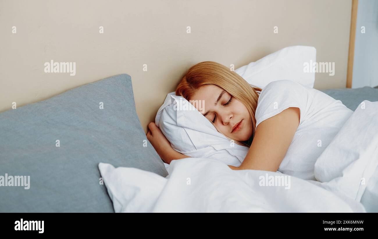 Bed relax. Good dream. Comfortable morning. Tranquil lazy girl sleeping ...