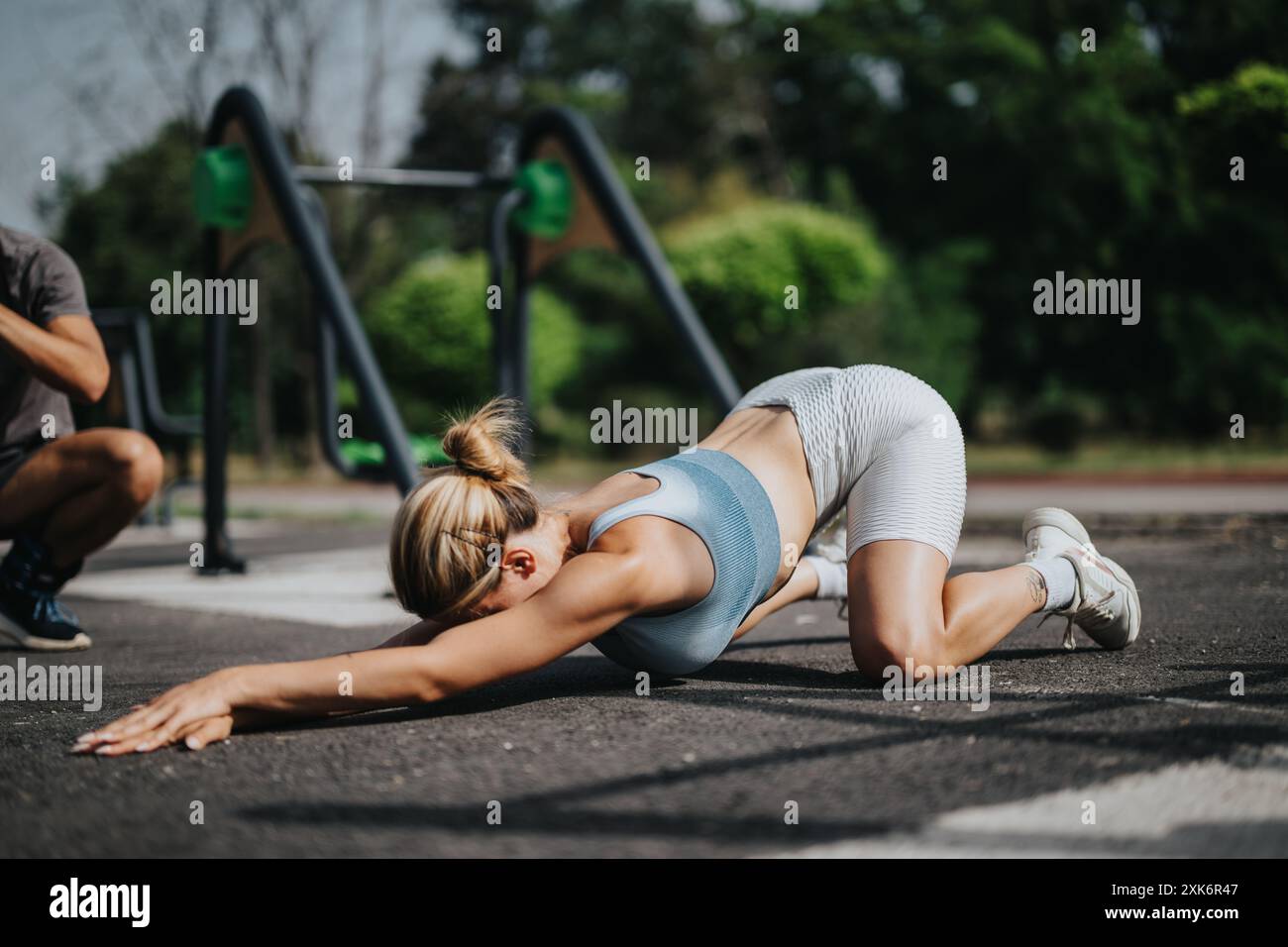 Woman performing outdoor calisthenics workout in a sunny park Stock ...