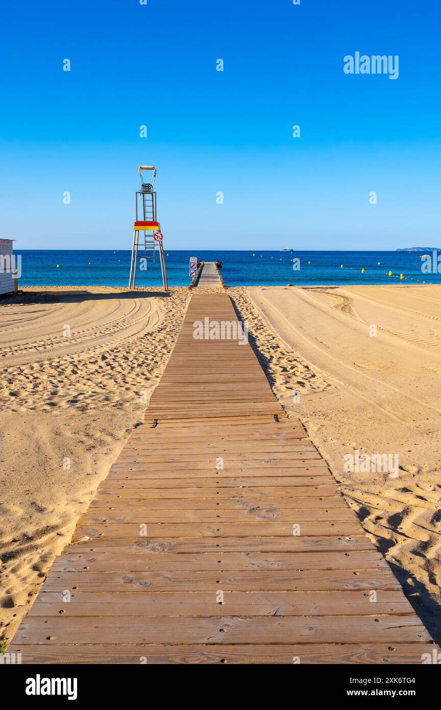 Morning view on crystal clear blue water and pier of Plage du ...