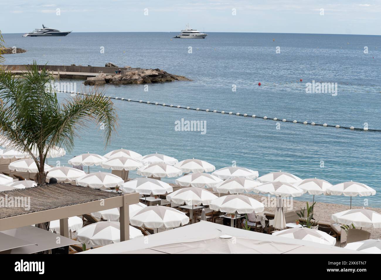 Sandy beach in Monaco, Monte-Carlo Lavrotto beach with clear sea water ...